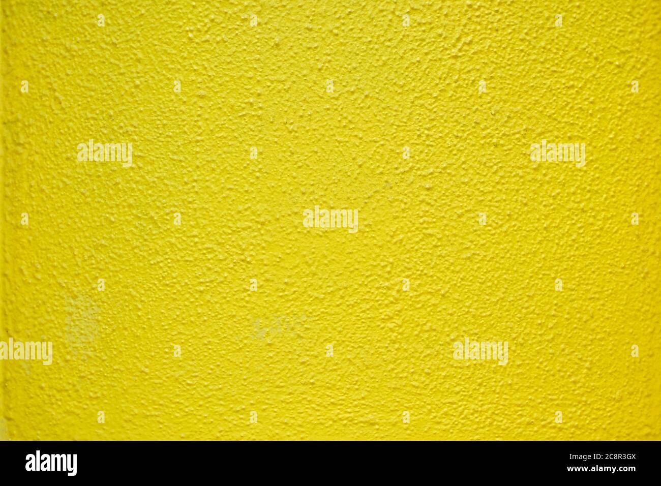 Bold vibrant yellow textured surface Stock Photo - Alamy