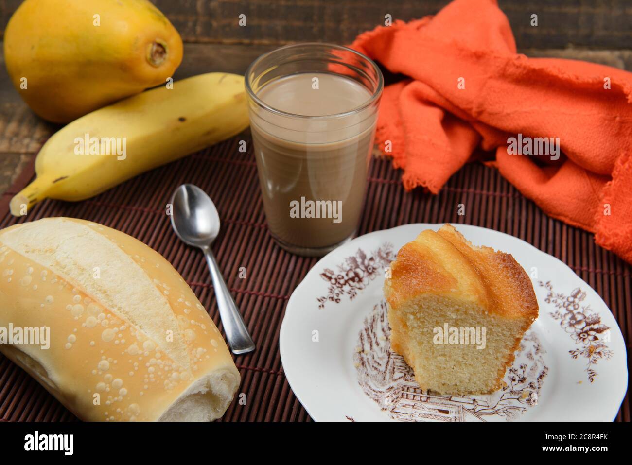 typical brazilian small breakfast, with cup of coffee with milk bread ...