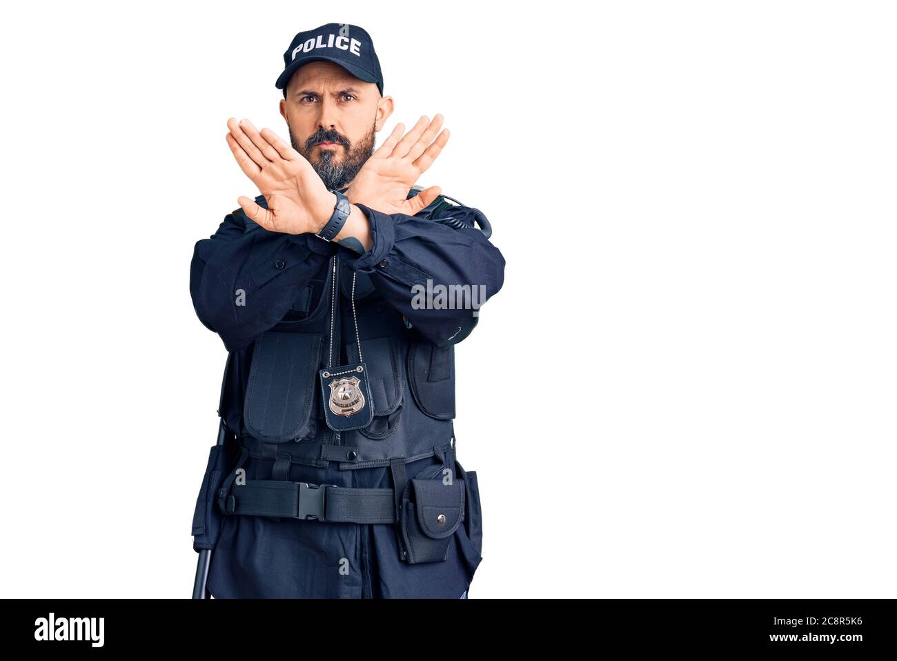 Young handsome man wearing police uniform rejection expression crossing ...