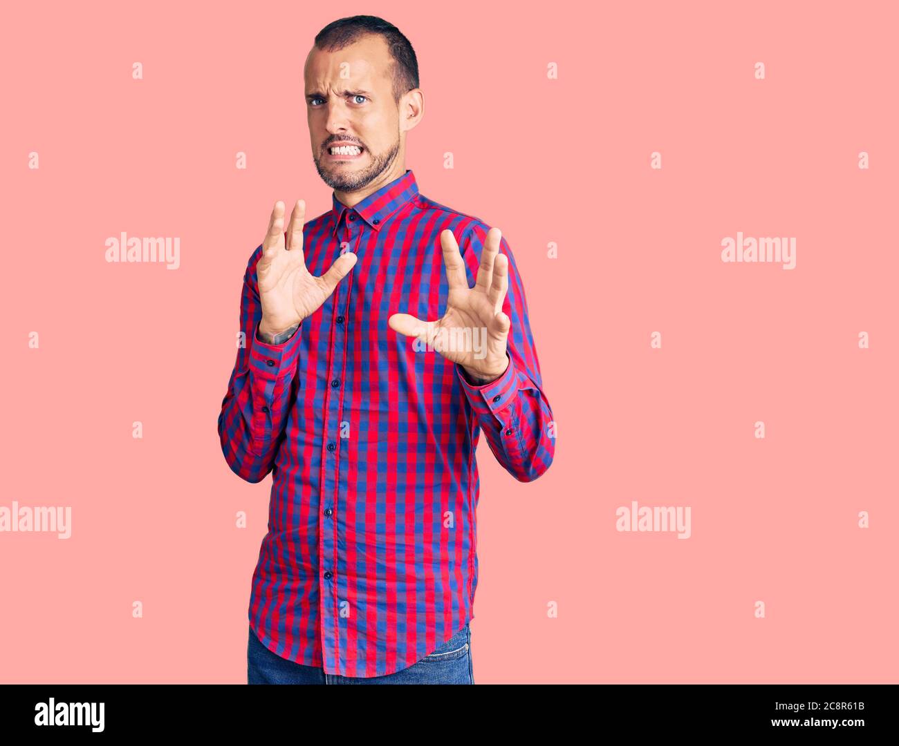 Young handsome man wearing casual clothes disgusted expression ...