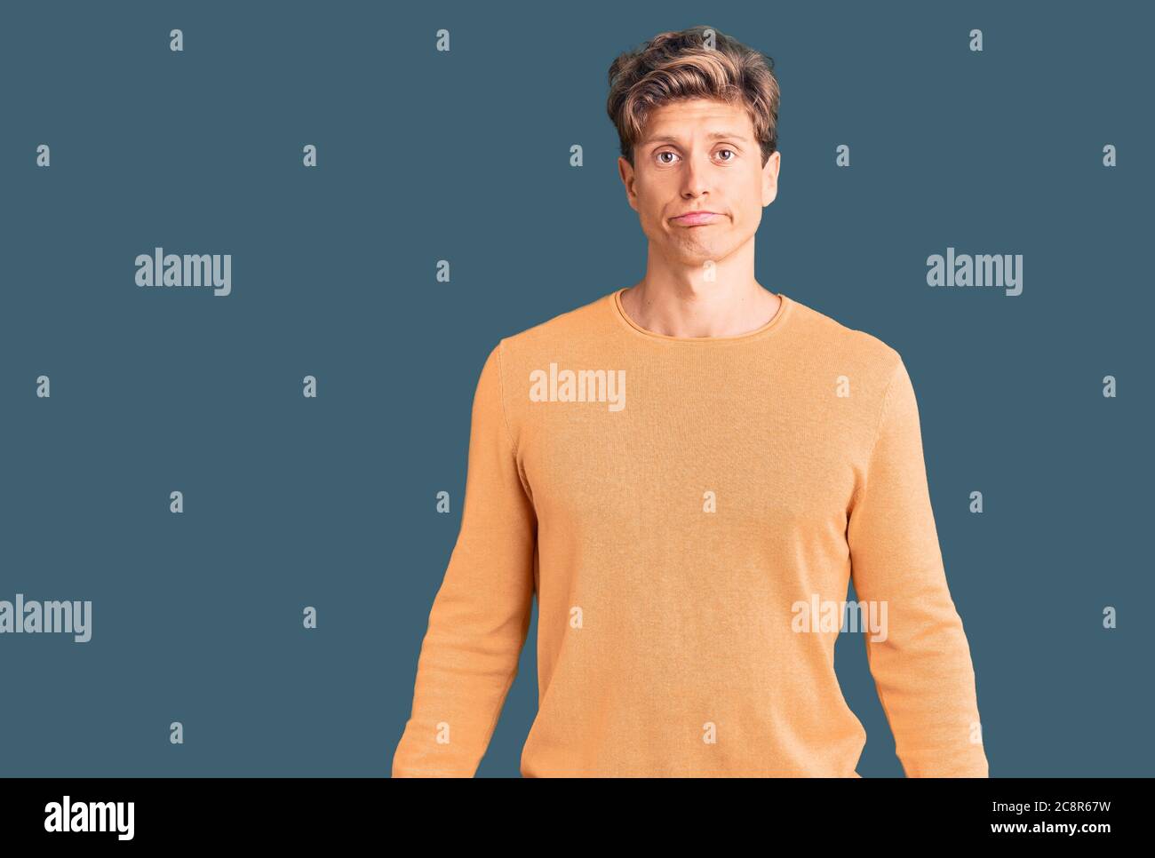 Young handsome man wearing casual clothes depressed and worry for ...