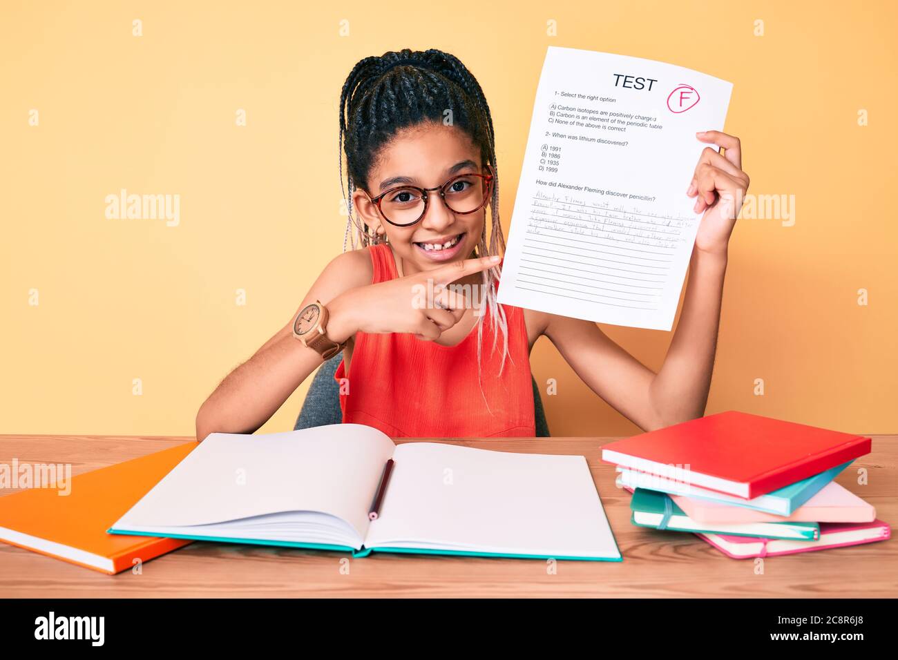 Young african american girl child with braids showing failed exam ...