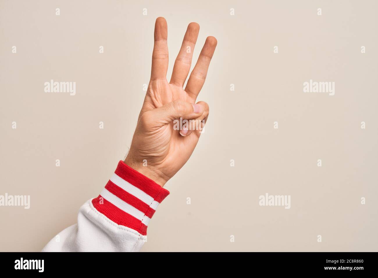 Hand of caucasian young man showing fingers over isolated white ...