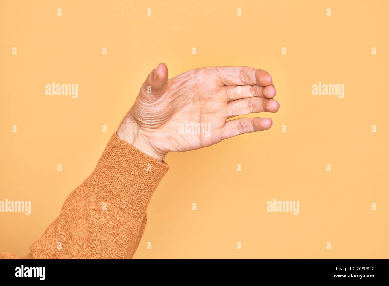 Hand of caucasian young man showing fingers over isolated yellow ...
