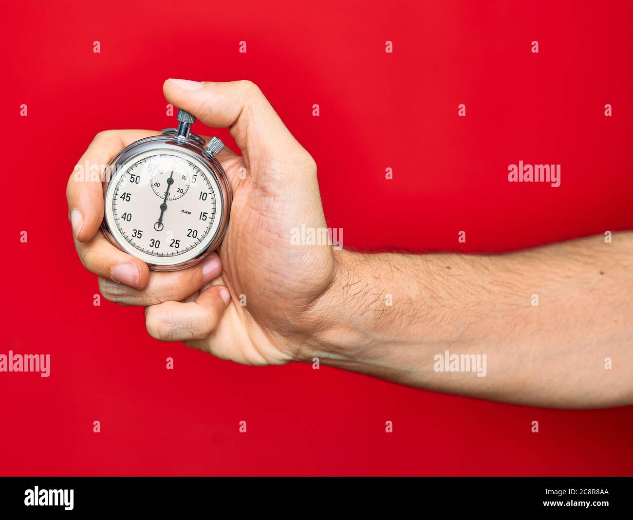 Beautiful hand of man holding stopwatch doing countdown over isolated ...