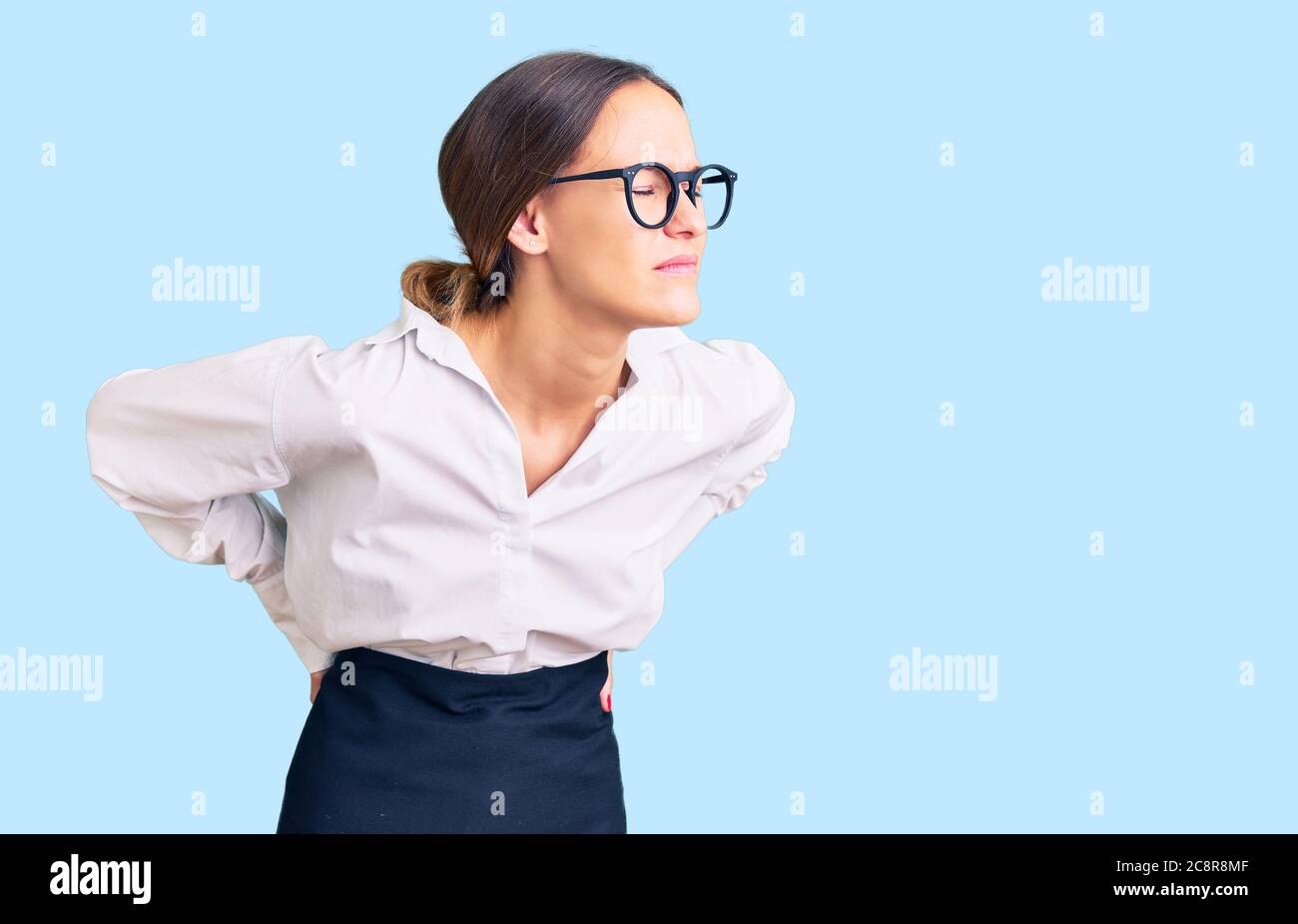 Beautiful brunette young woman wearing professional waitress apron ...