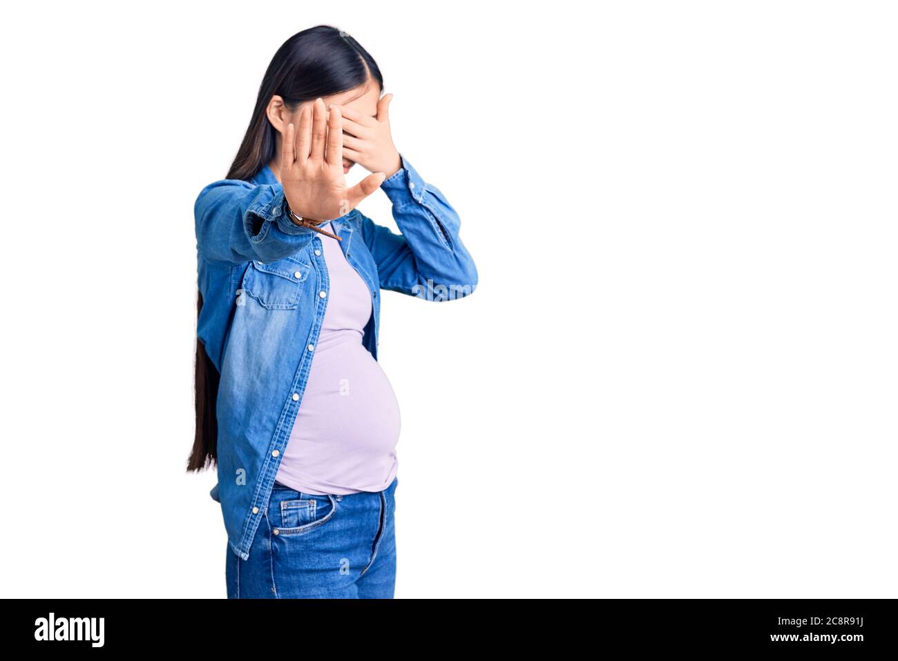 Embarrassed pregnant woman Cut Out Stock Images & Pictures - Alamy
