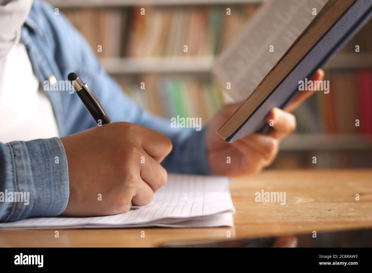 Asian muslim woman studying learning in library, exam preparation ...