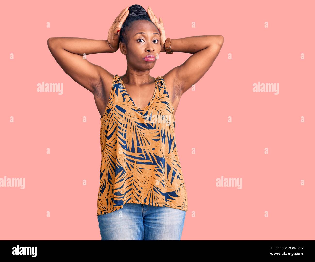 Young african american woman wearing casual clothes doing bunny ears ...