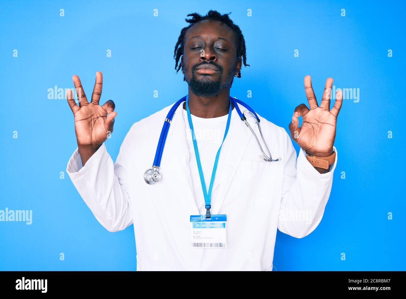 Young african american man with braids wearing doctor stethoscope and ...