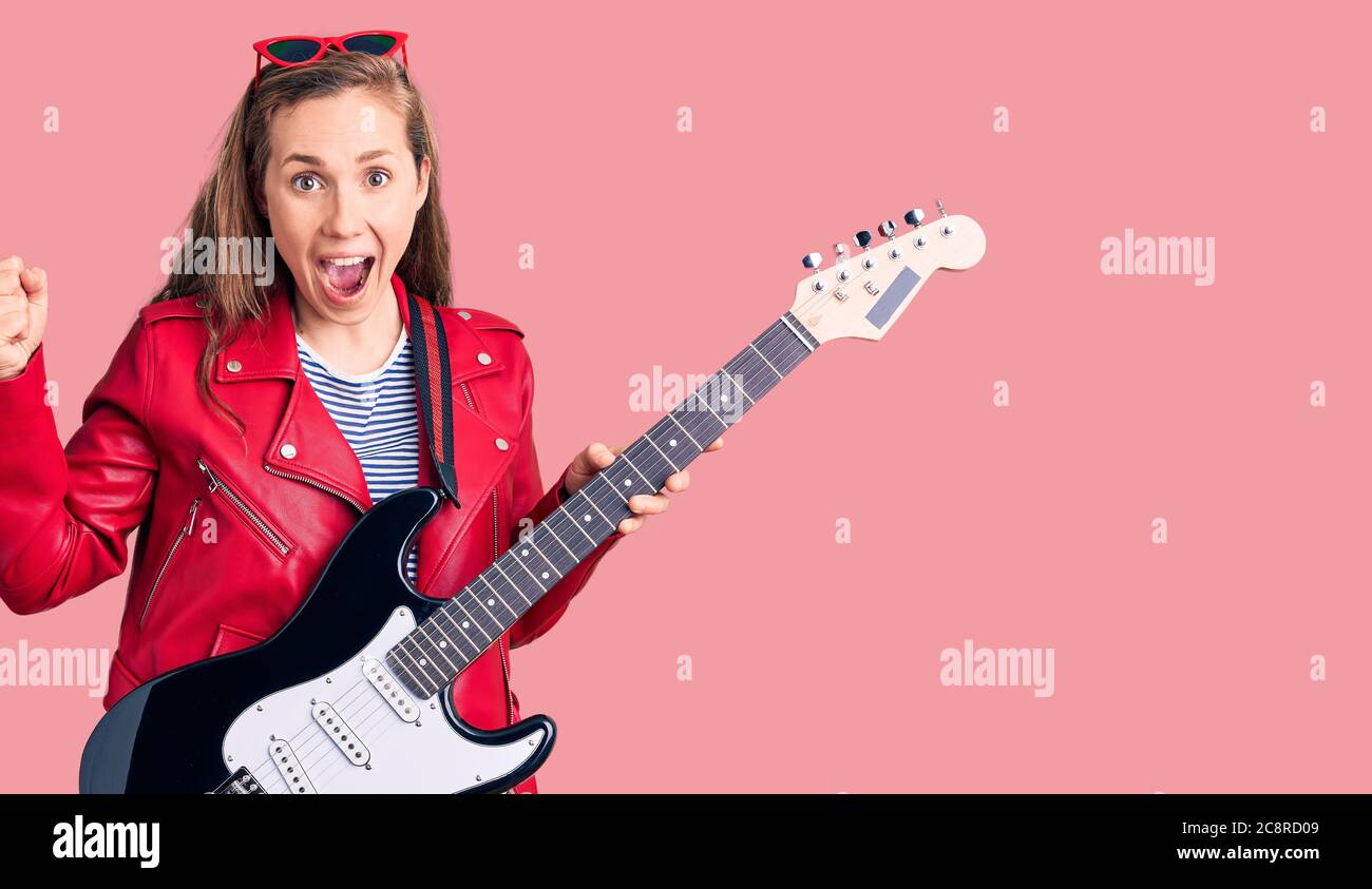 Excited young blonde artist hi-res stock photography and images - Alamy