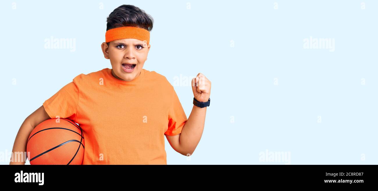 Little boy kid holding basketball ball screaming proud, celebrating ...