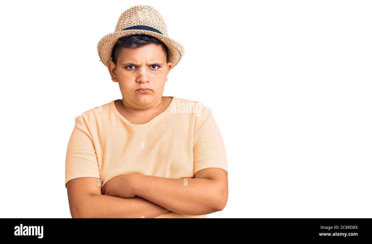 Little boy kid wearing summer hat and hawaiian swimsuit skeptic and ...
