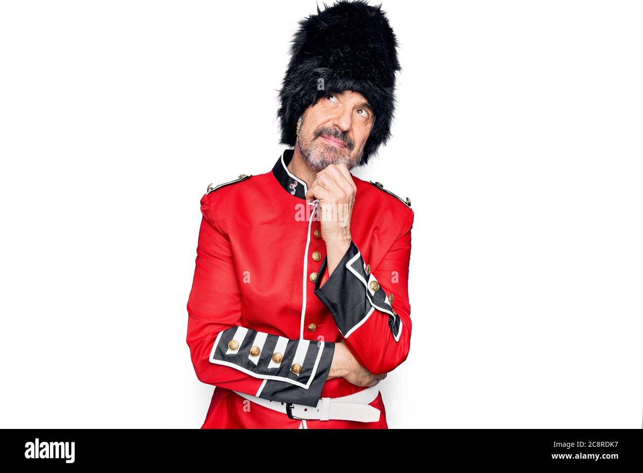 Middle age handsome wales guard man wearing traditional uniform over ...