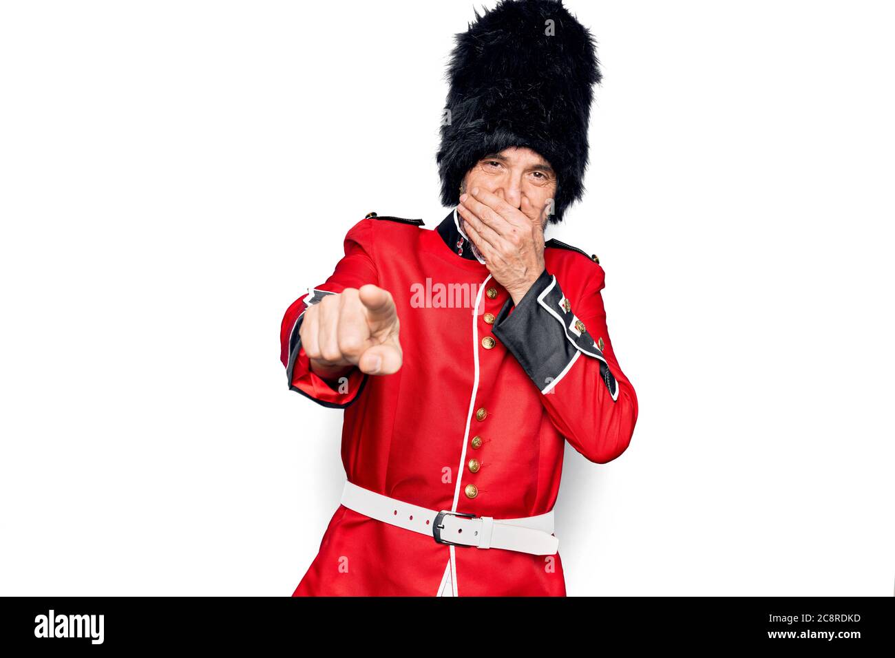 Middle age handsome wales guard man wearing traditional uniform over ...