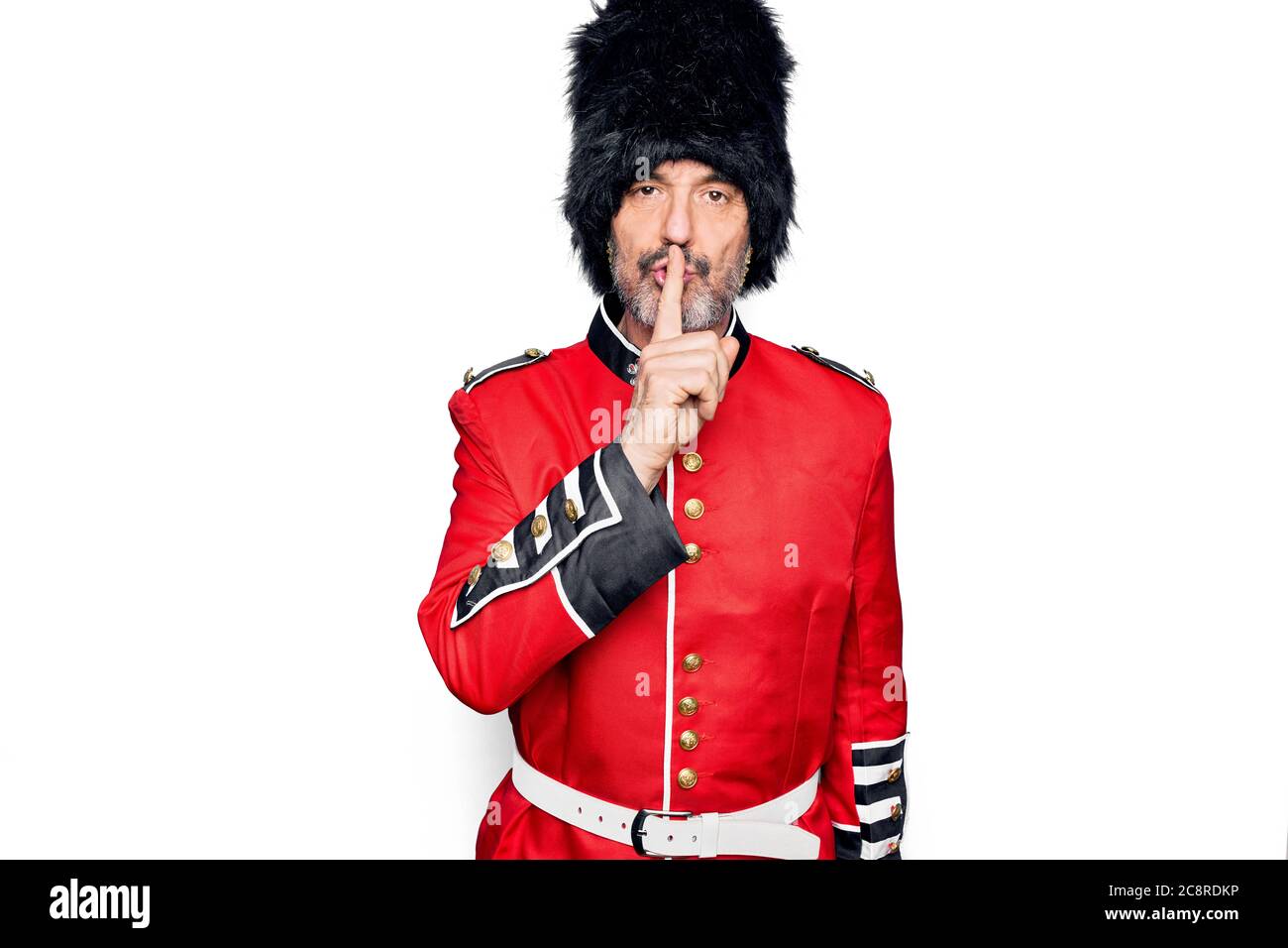 Middle age handsome wales guard man wearing traditional uniform over ...