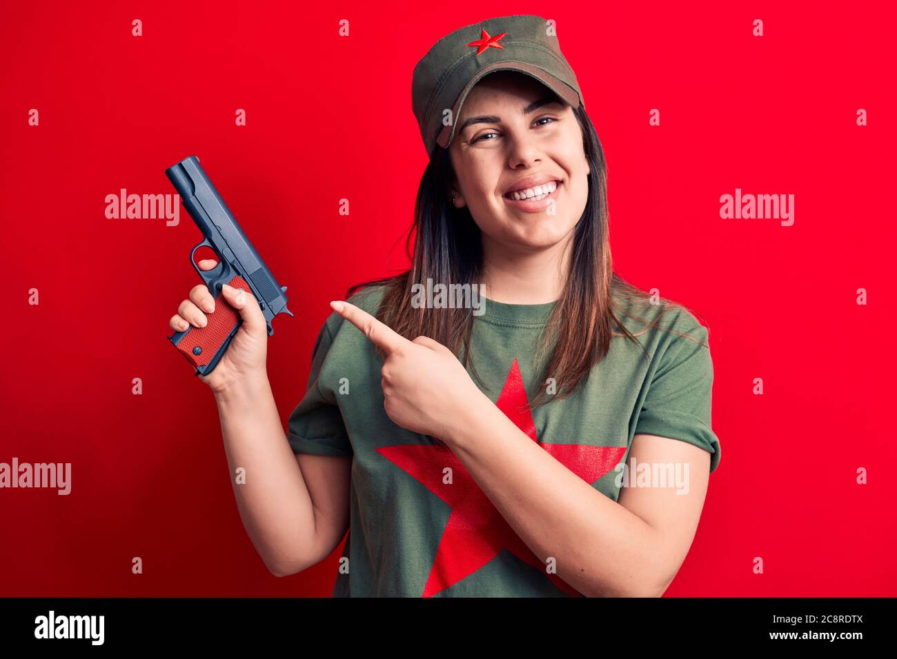 Portrait confident military woman gun hi-res stock photography and ...
