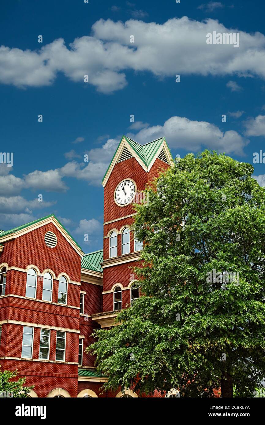 Red Brick Courthouse by Tree Stock Photo - Alamy