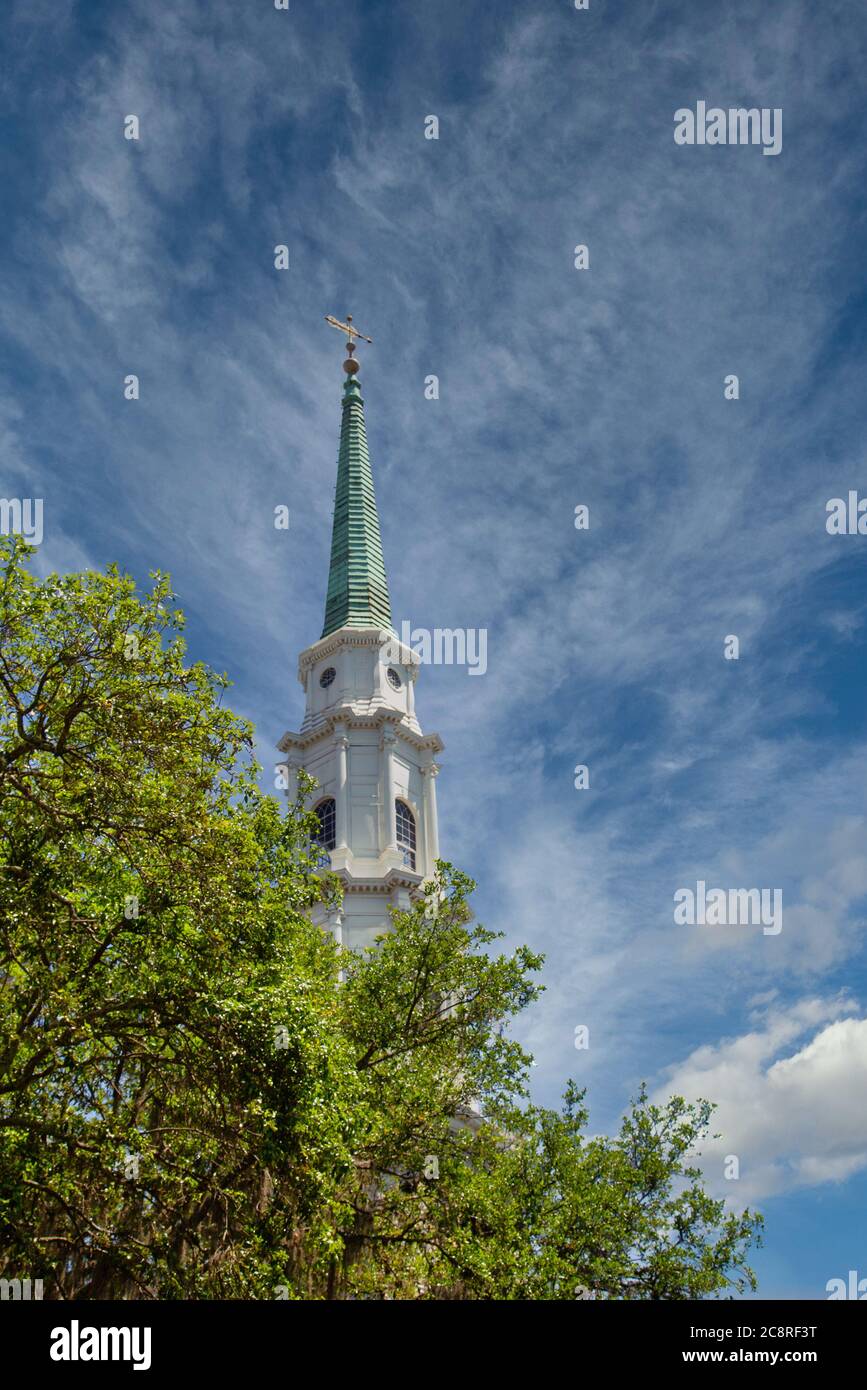 Steeple Past Trees on Sky Stock Photo - Alamy
