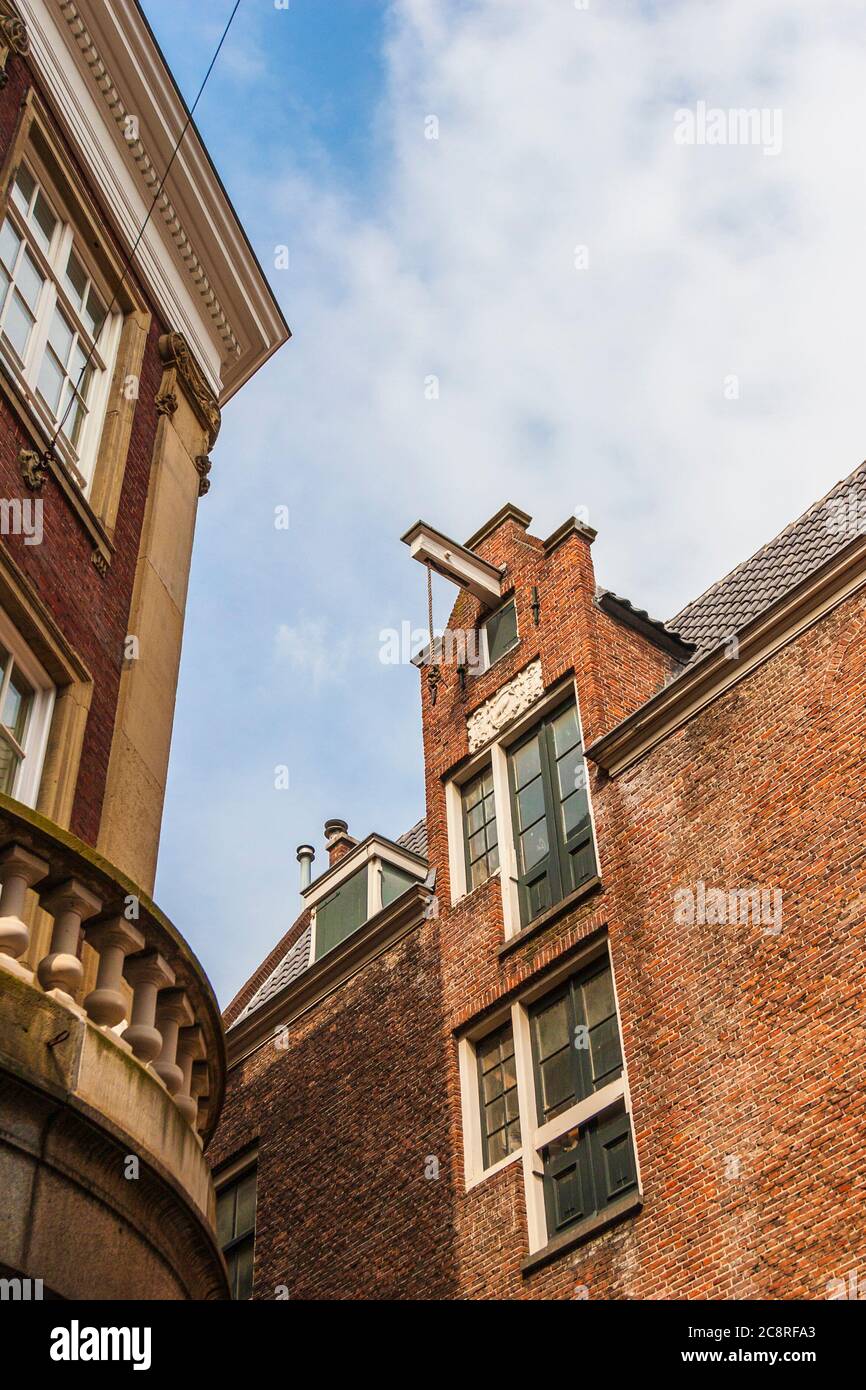 Dutch architecture with furniture hooks on narrow buildings along the ...