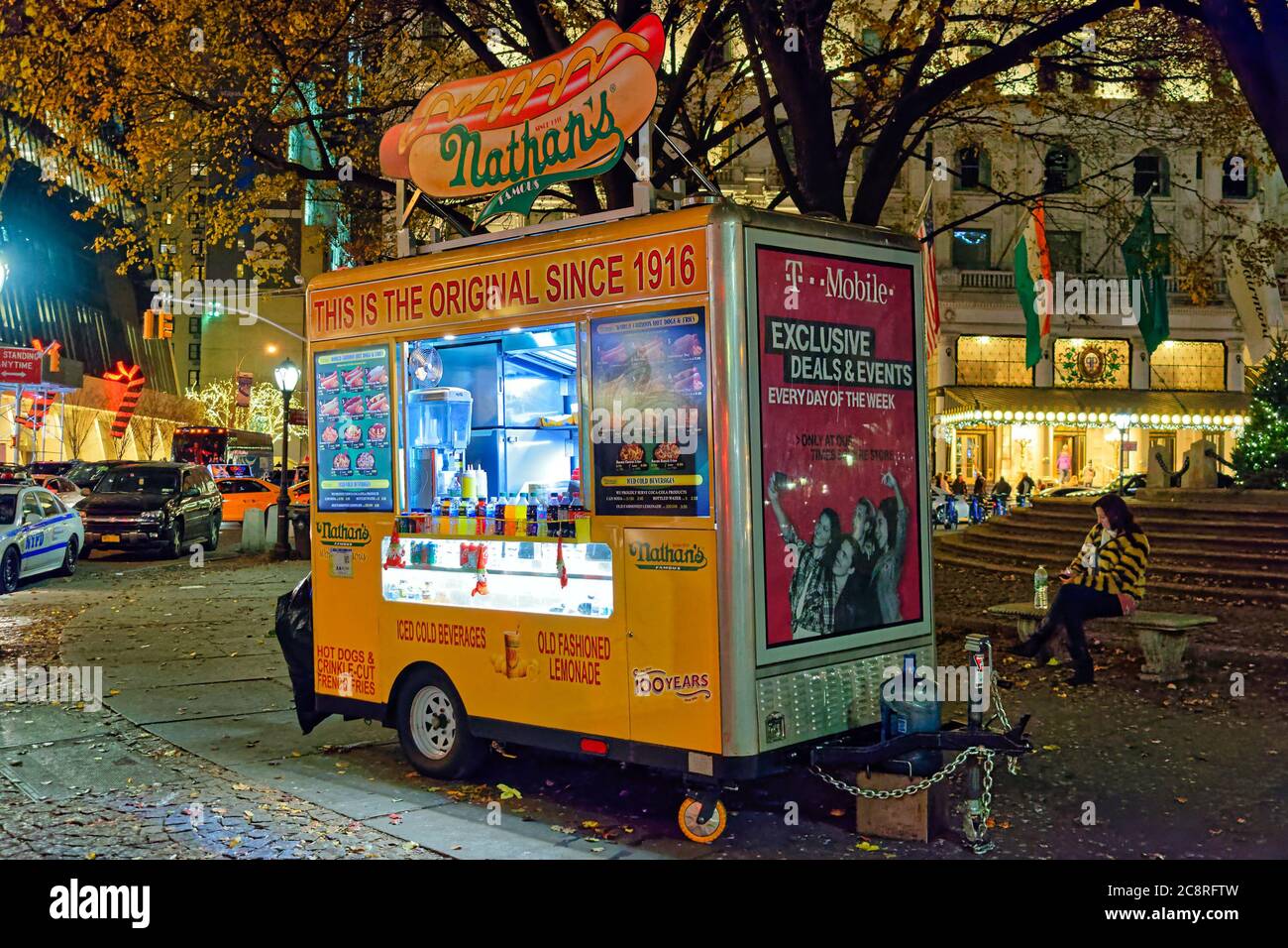 The traditional street food cart selling hot dogs, french fries and ...