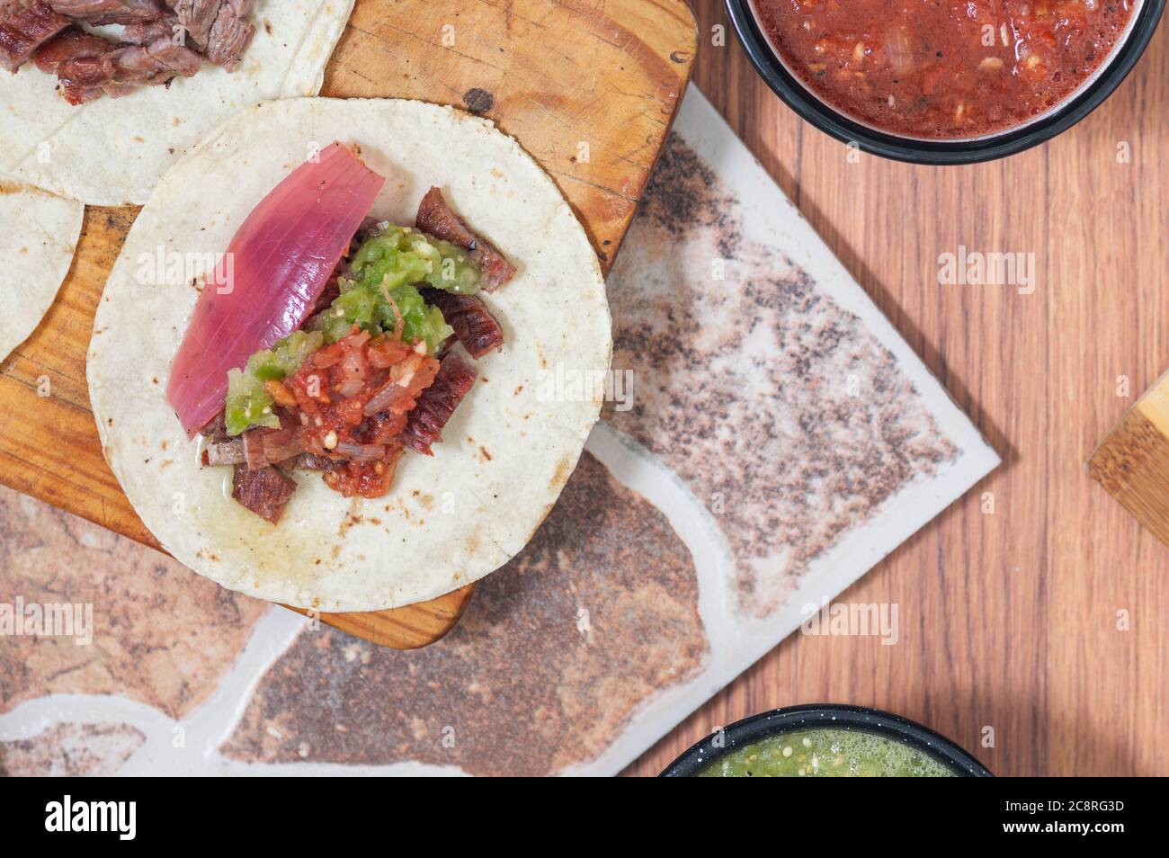 Carne Asada, Mexican barbecue, tacos of beef with homemade salsas Stock ...