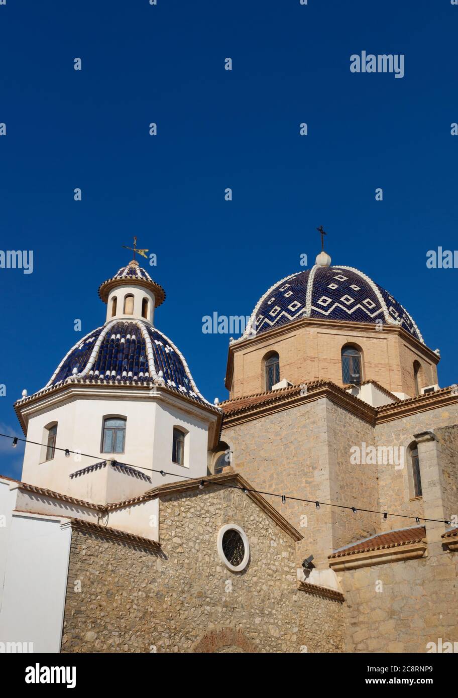 Our Lady of Solace Church with blue tiled domes and blue sky in old ...