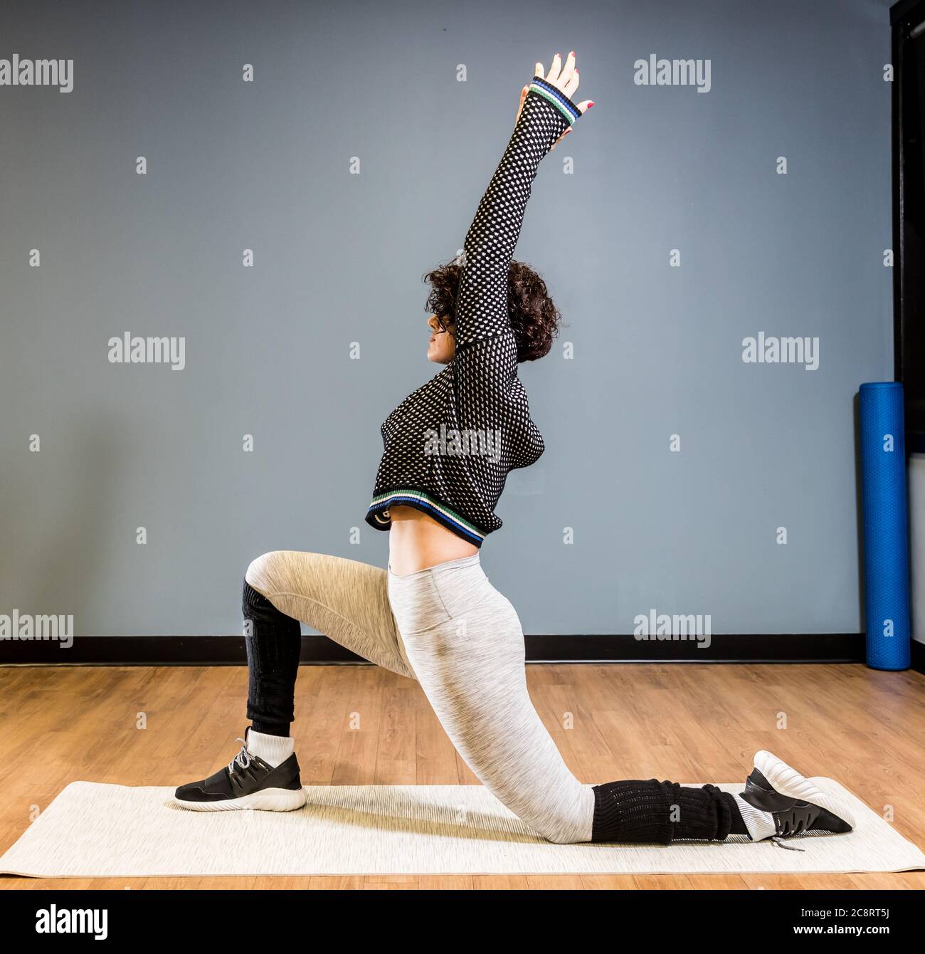 Young woman demonstrating exercise positions Stock Photo - Alamy