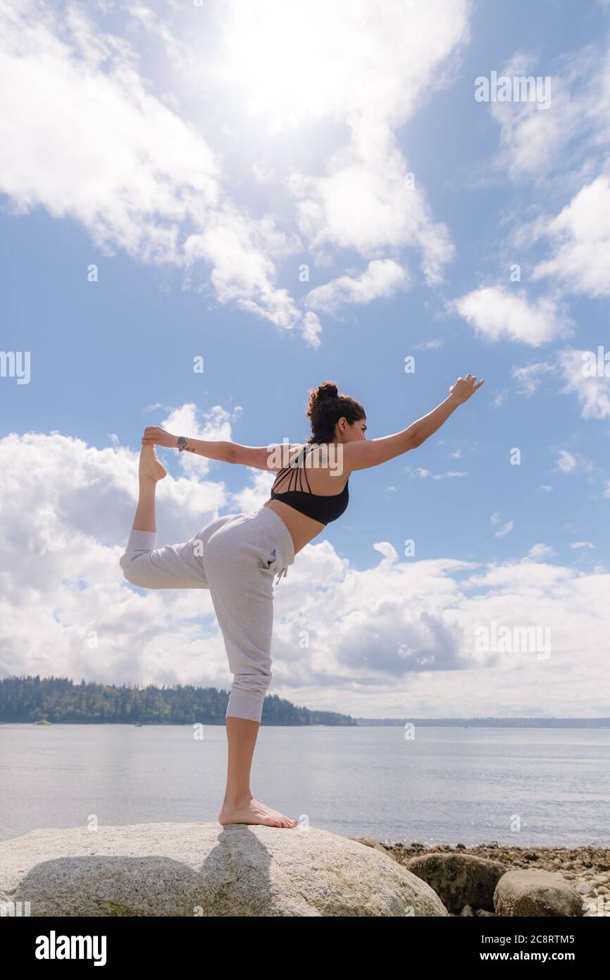 Young woman doing yoga poses Stock Photo - Alamy