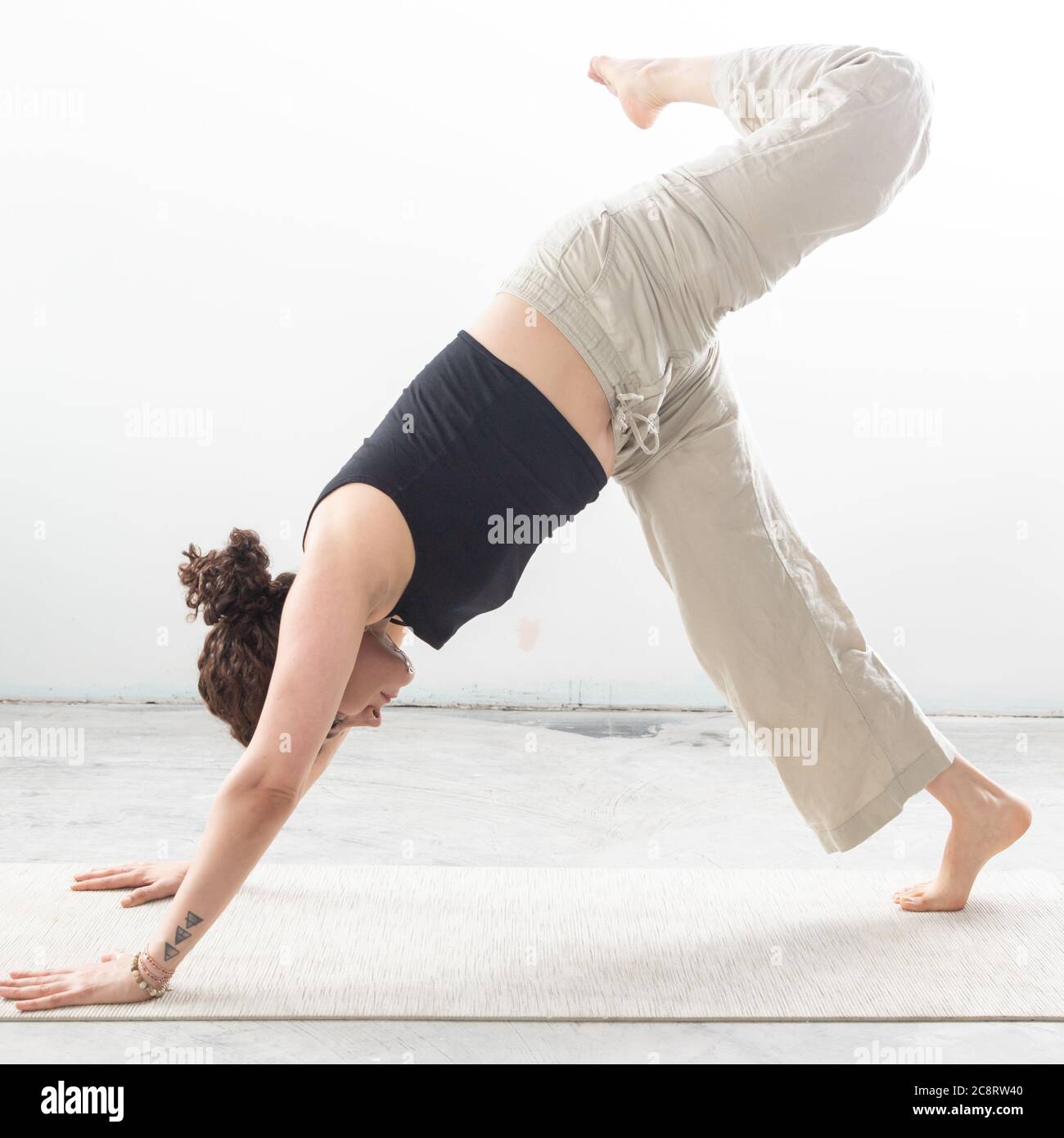 Fitness coach demonstrating stretches in studio Stock Photo - Alamy
