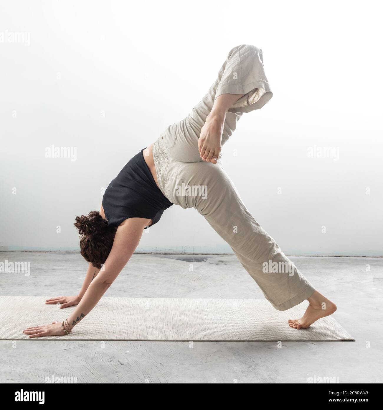 Fitness coach demonstrating stretches in studio Stock Photo - Alamy