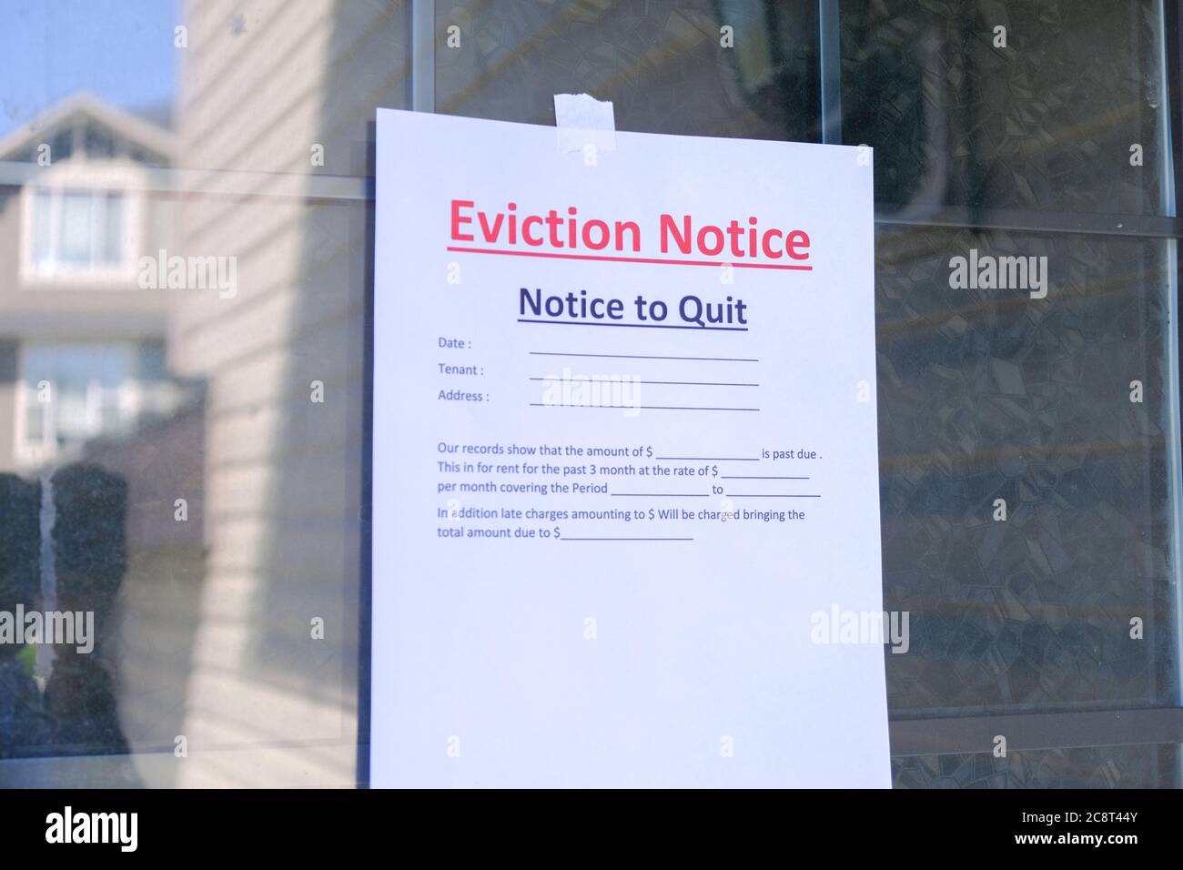 Eviction Notice served to tenant hanging on door Stock Photo - Alamy