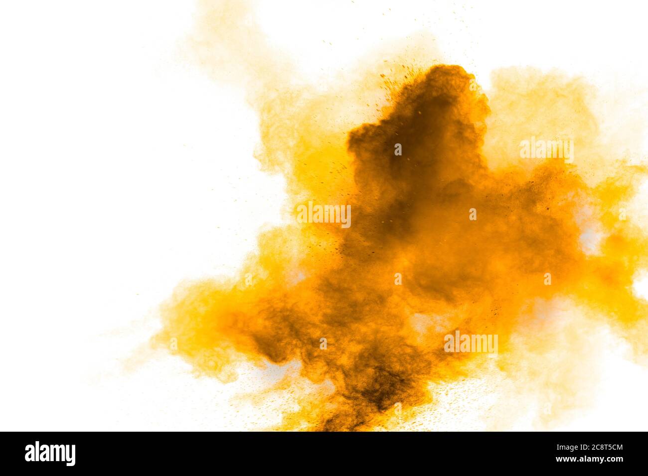 Orange yellow powder explosion on white background Stock Photo - Alamy