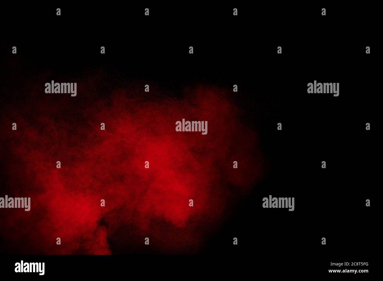 Red powder explosion cloud on black background. Freeze motion of red ...