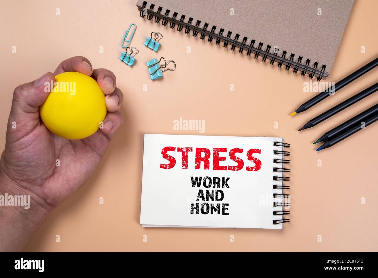 Stress at work and home concept. Note paper, colored pencils and ...