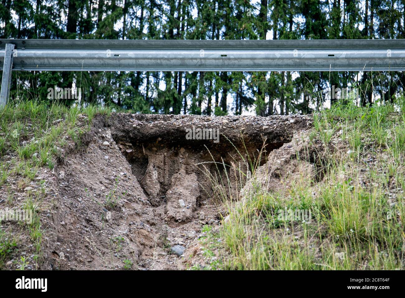 Washed out side of road after heavy rain. Bottom view. Challenge for ...