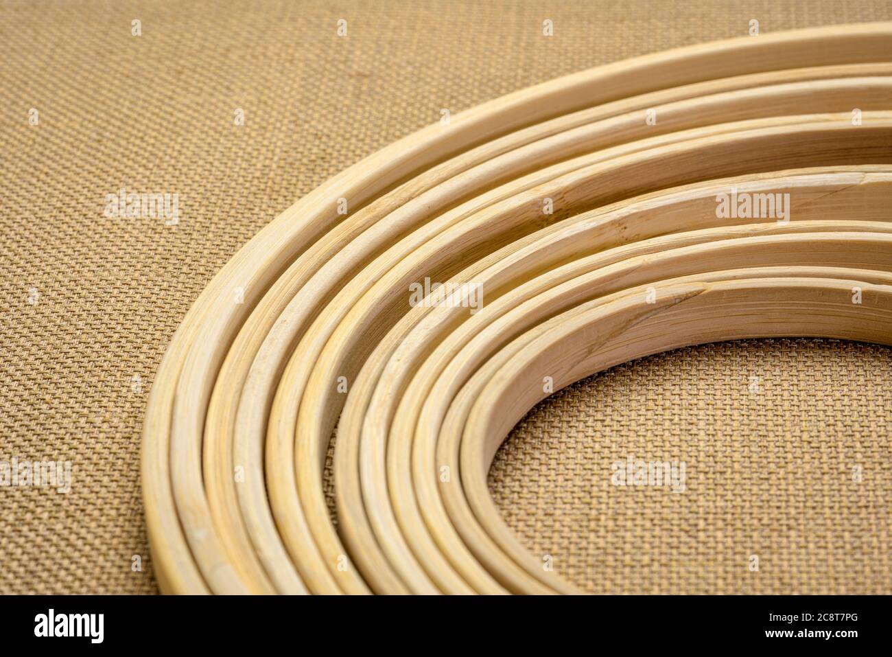 set of bamboo embroidery hoops against burlap canvas, craft and hobby ...