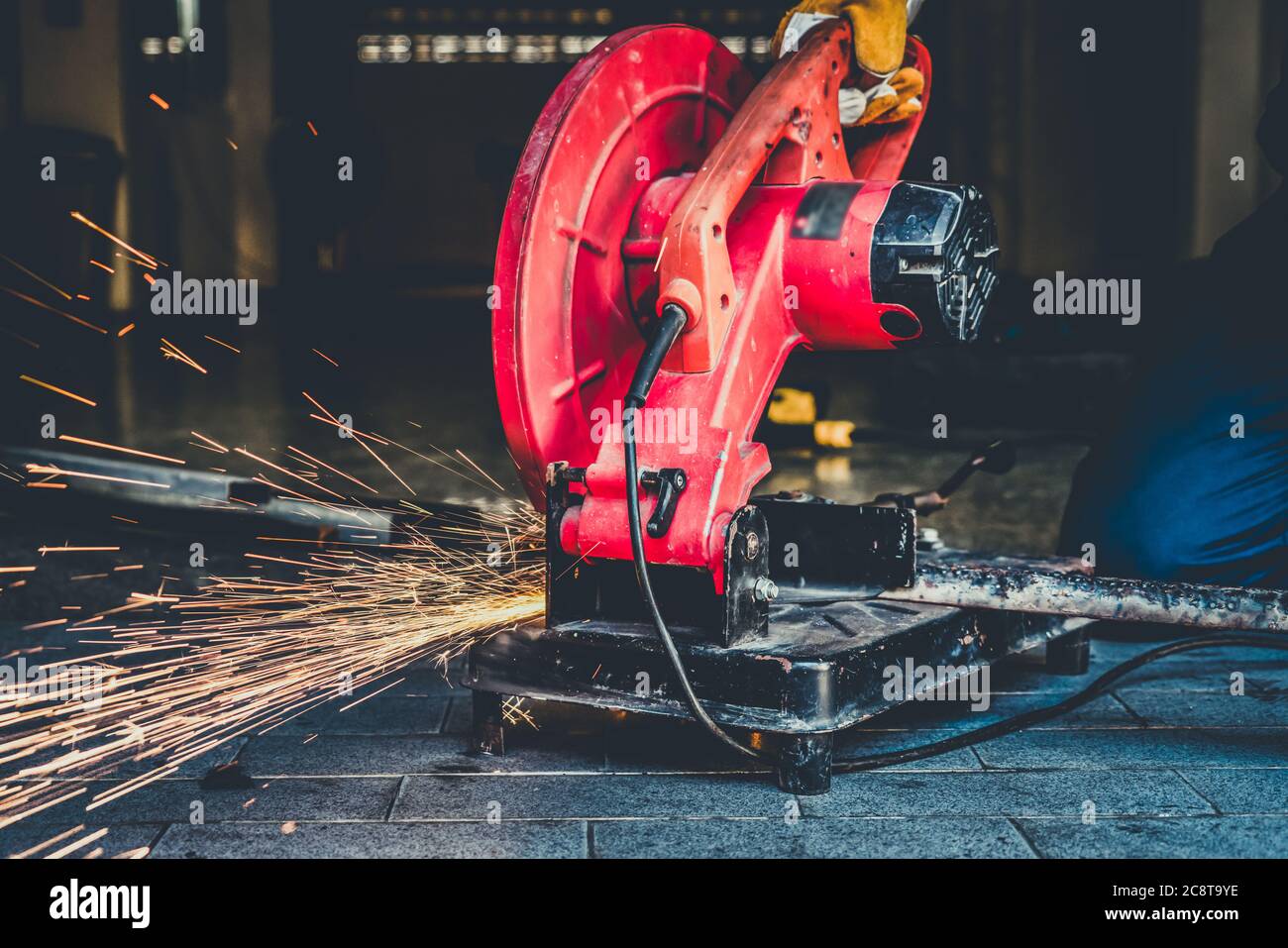 Professional mechanic is cutting steel metal Stock Photo - Alamy