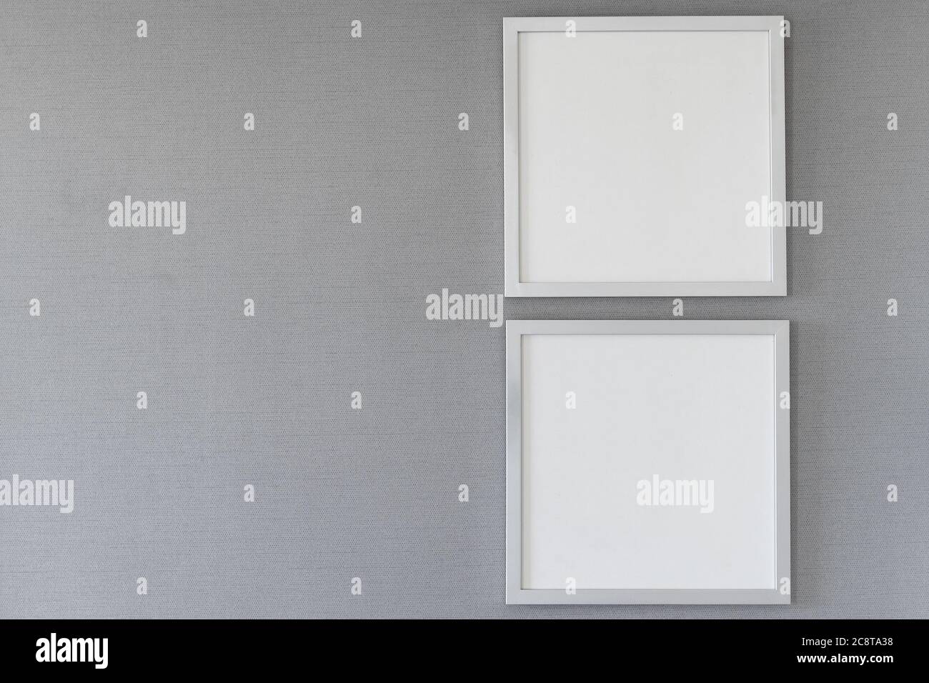 Group of white frames on grey texture wallpaper, Gallery style design ...