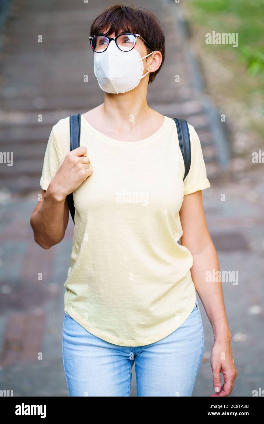 Beautiful Middle-aged woman walking down the street Stock Photo - Alamy