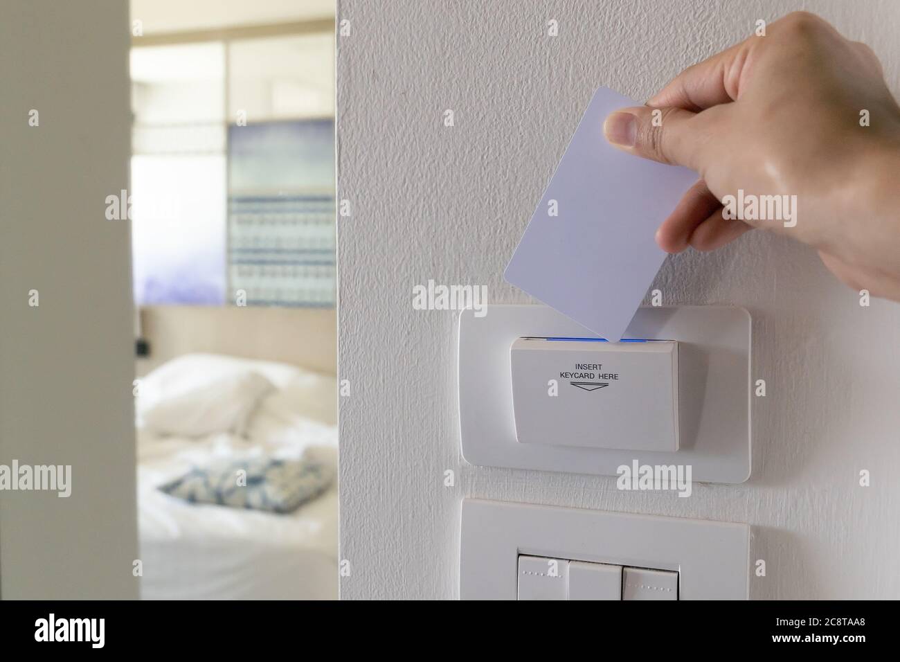 Hand insert key card in the luxury hotel room Stock Photo - Alamy