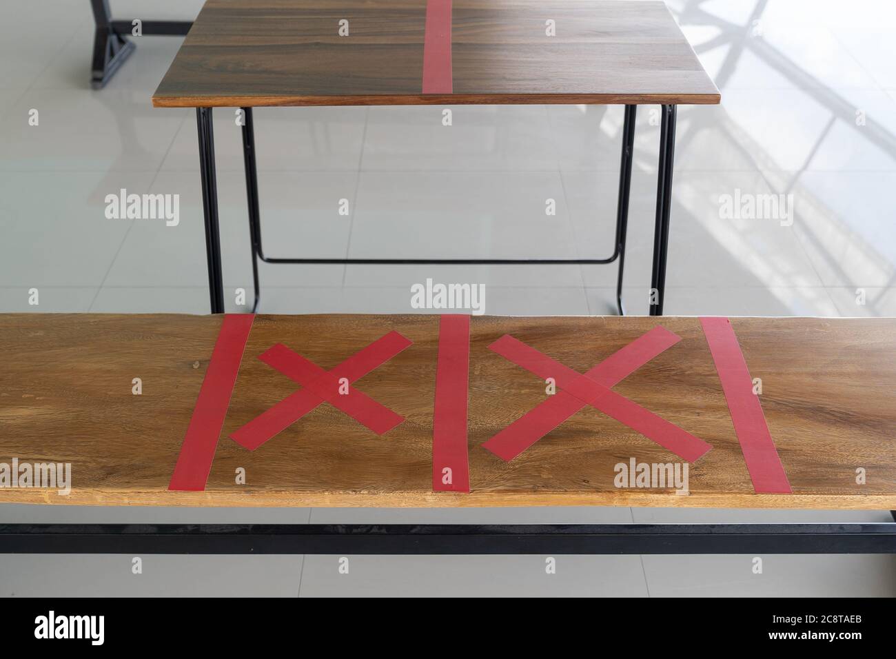 Marking on empty wooden chair without nobody sitting on it. Keep spaced ...