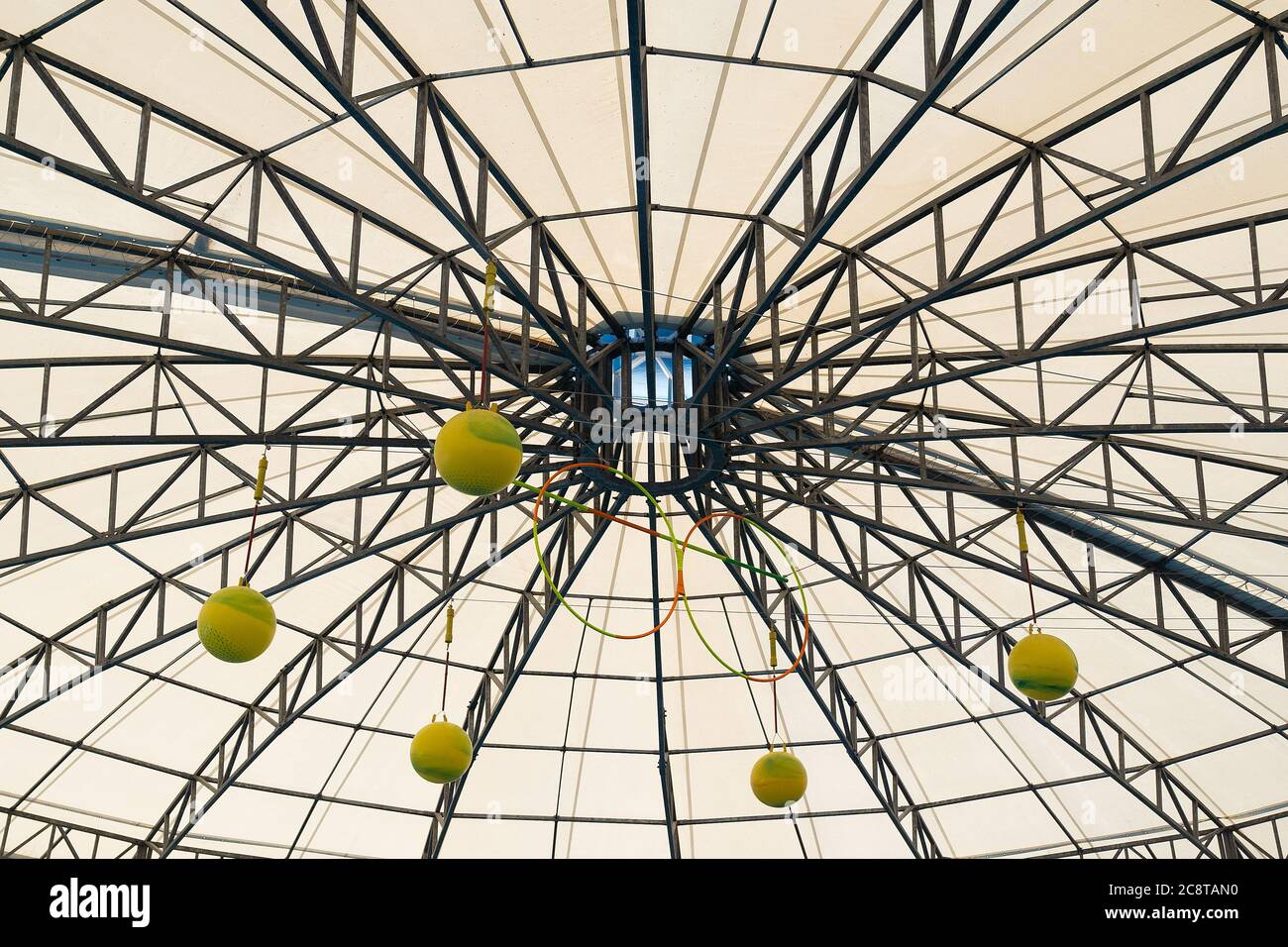 Metal ceiling structure with yellow ball hall show. Metal structure of ...