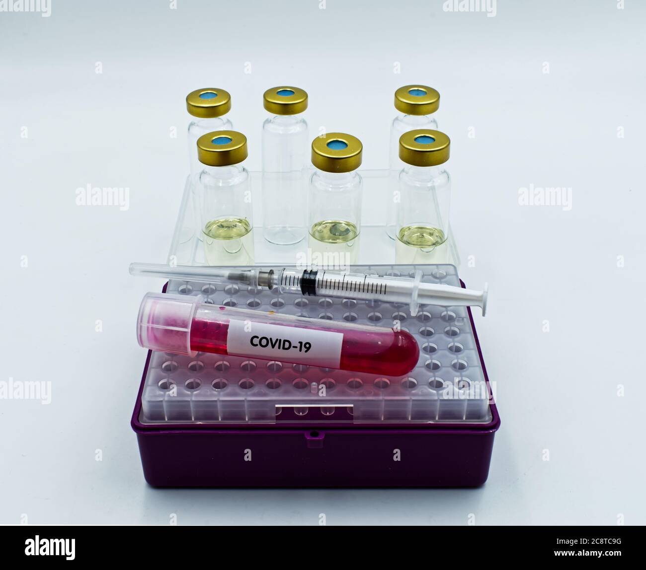 Test tube with covid-19 label and syringe injection Stock Photo - Alamy