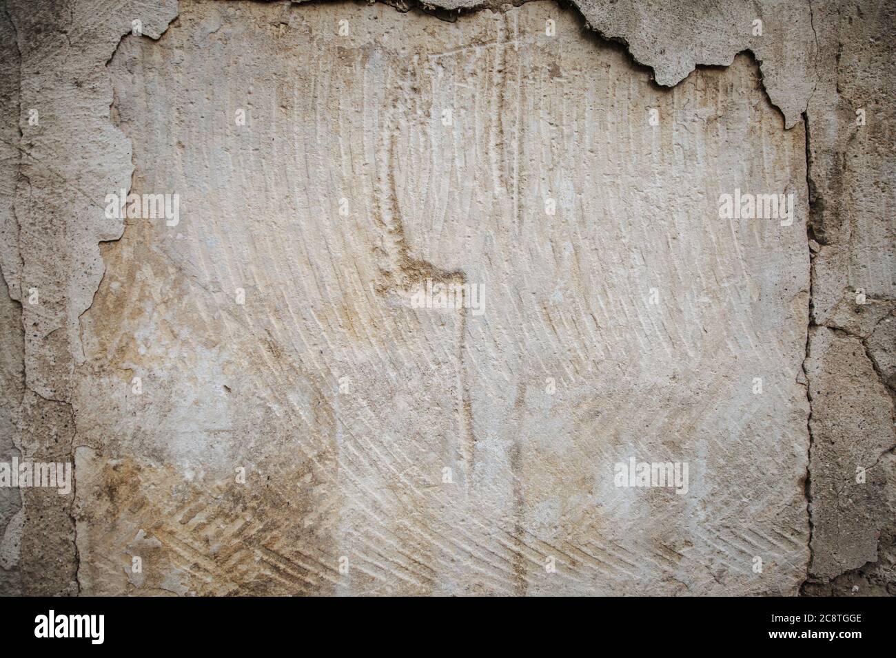 Plaster peeling off brick wall. The foundation of a residential ...