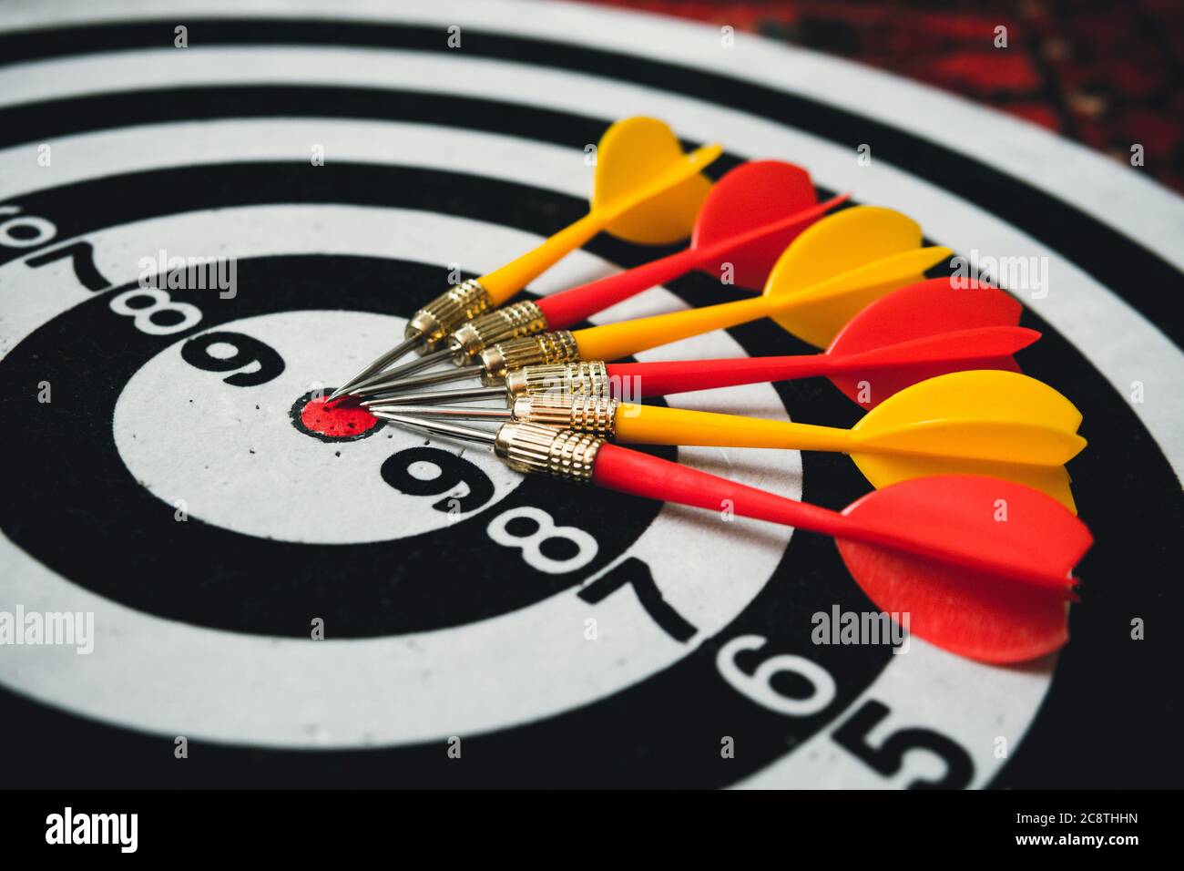 red and yellow dart on target board right frame. yellow and red Darts ...