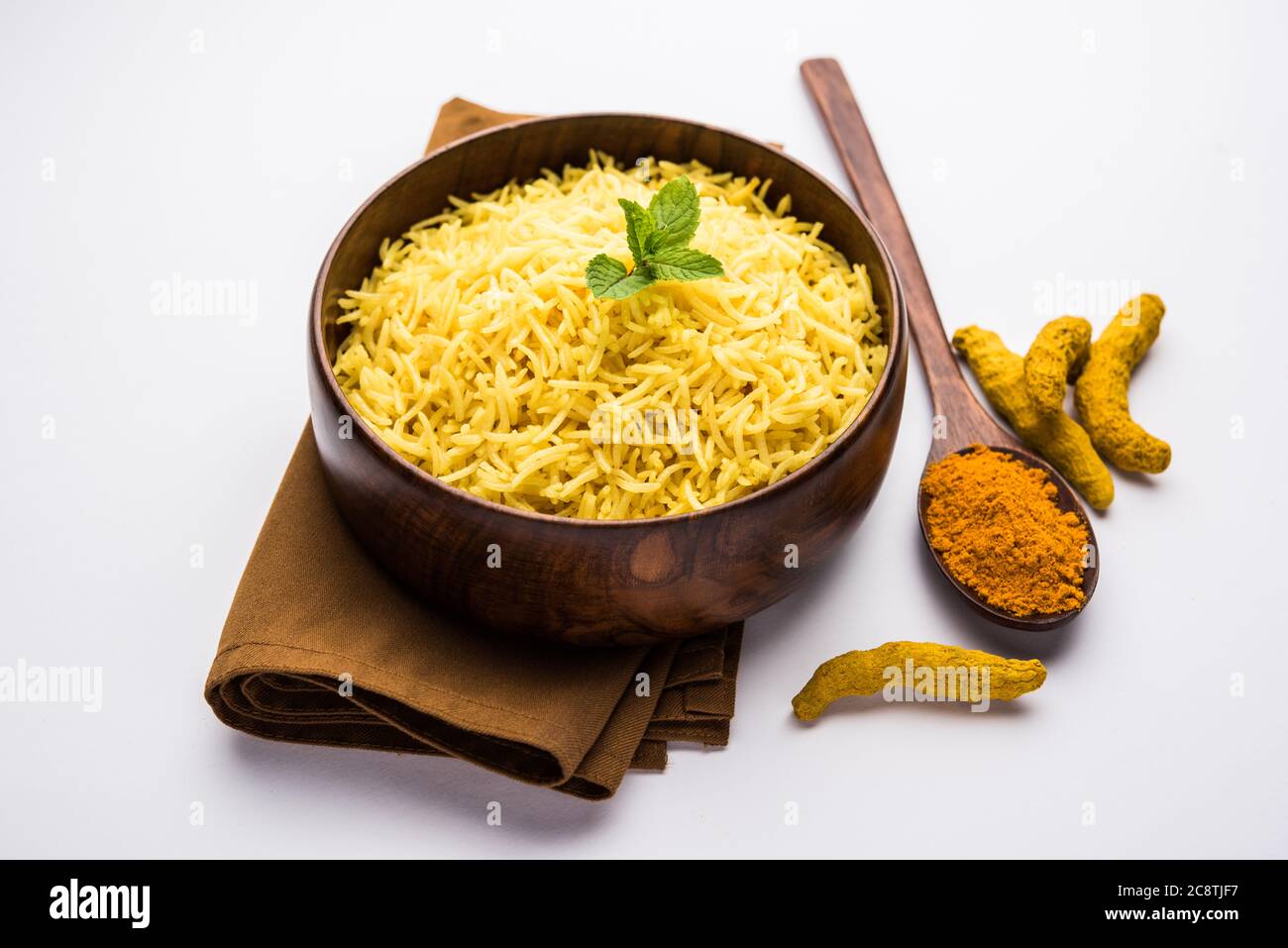 Cooked turmeric jasmine rice with powdered curcumin or Haldi, Indian ...