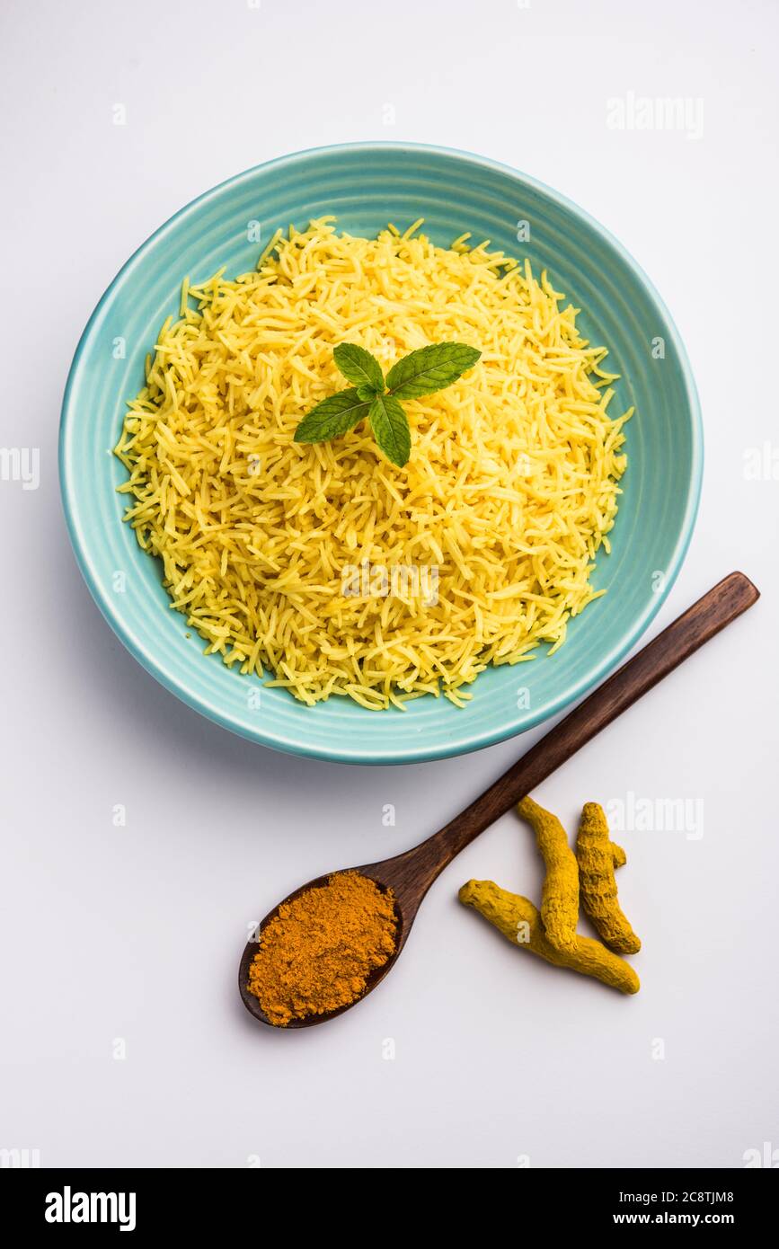 Cooked turmeric jasmine rice with powdered curcumin or Haldi, Indian ...