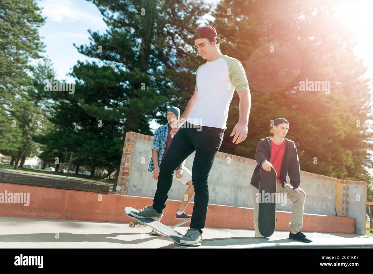 Three guys walking together in hi-res stock photography and images - Alamy