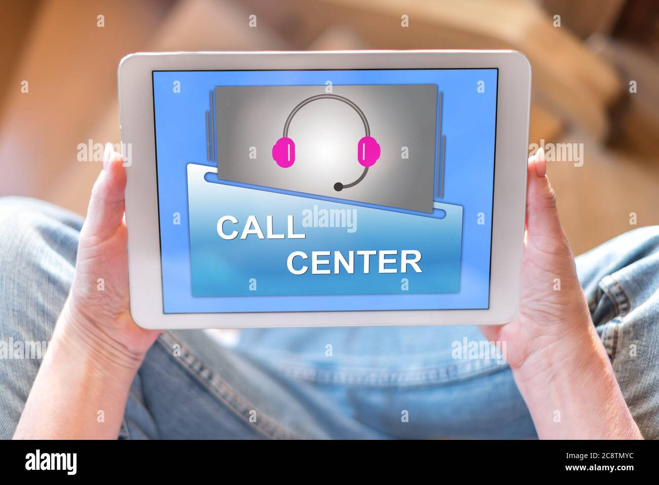 Tablet screen displaying a call center concept Stock Photo - Alamy